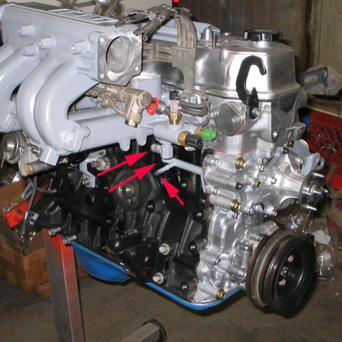 How do I replace the coolant lines under the intake manifold on a 22re ...