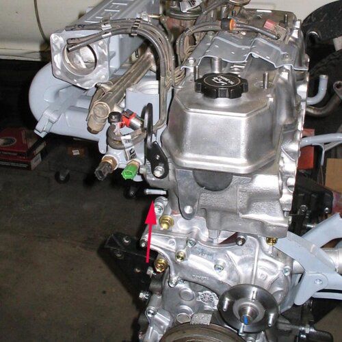 How do I replace the coolant lines under the intake manifold on a 22re ...